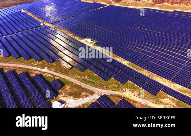 Solar farm sections divided by access roads, Bulgaria. Elevated drone ...