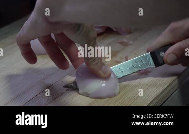 person cutting an onion. High quality 4k footage Stock Video Footage ...