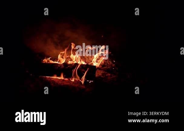 Bonfire at night on a dark background. Bright flame of a bonfire ...