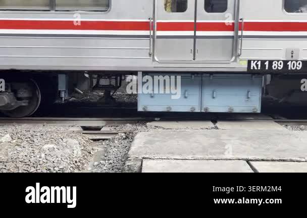 Low-angle footage of train wheels rolling on railway tracks ...