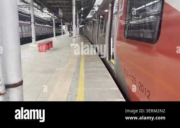 Point of view footage walking through an empty commuter train carriage ...