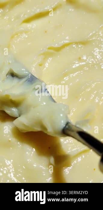 Close-up macro view of thick cream hair mask texture being swatched and ...