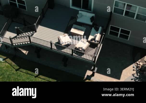 Aerial shoot of Modern elevated backyard deck attached to suburban ...