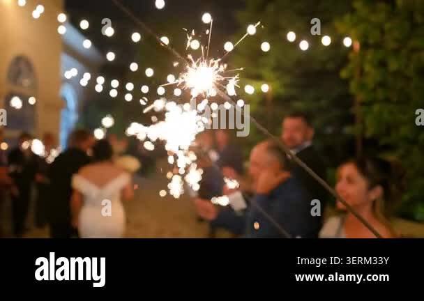 Close up shoot of Bright sparklers glowing during outdoor evening ...