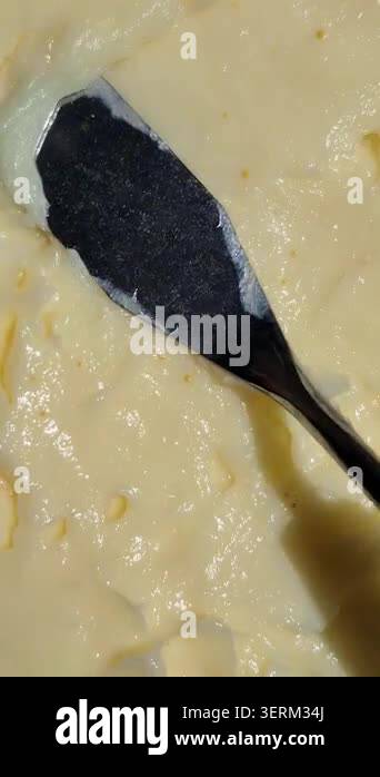Close-up macro view of thick cream hair mask texture being swatched and ...