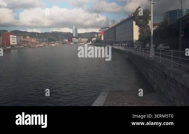 Cityscape view showing the nervion river flowing through bilbao with ...