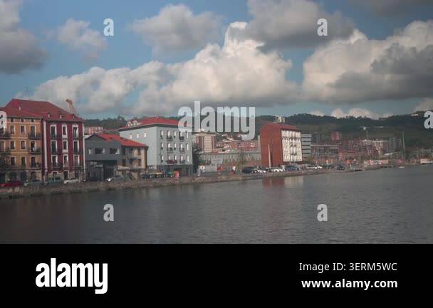 Picturesque cityscape of bilbao showing the banks of the nervion river ...