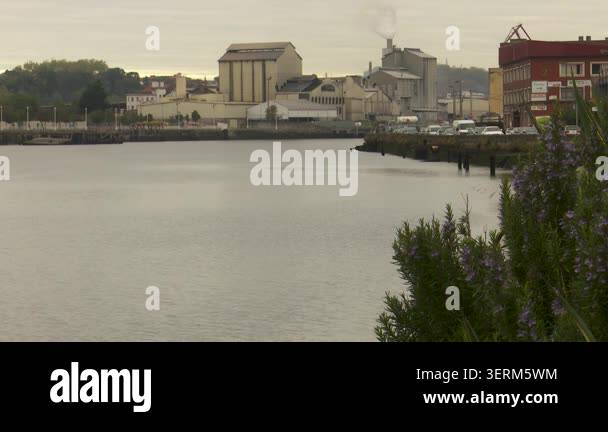 Urban landscape of the nervion river flowing through bilbao, spain ...