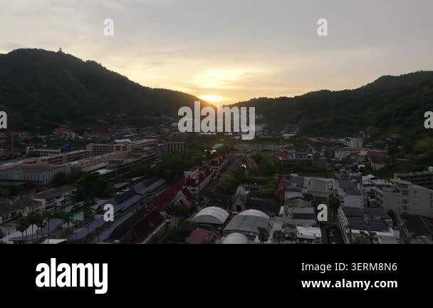 A breathtaking sunset unfolds over a vibrant cityscape, showcasing ...