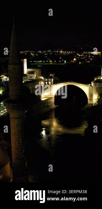 Night illuminated drone view of the historical Mostar bridge ...