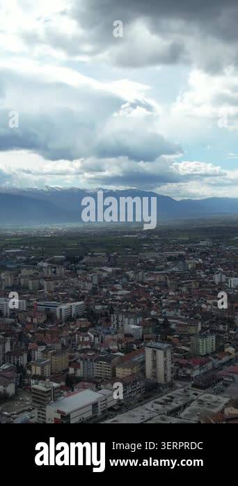 View of roofed houses and streets in the city of Tetovo, drone view of ...