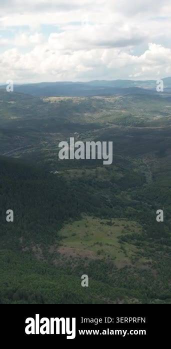 Aerial Mountain Terrain, view of cloudy and mountainous areas from the ...