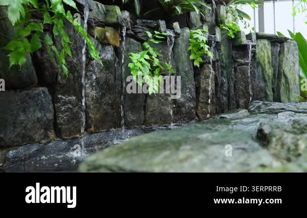Small artificial waterfalls. The water feature consists of numerous ...