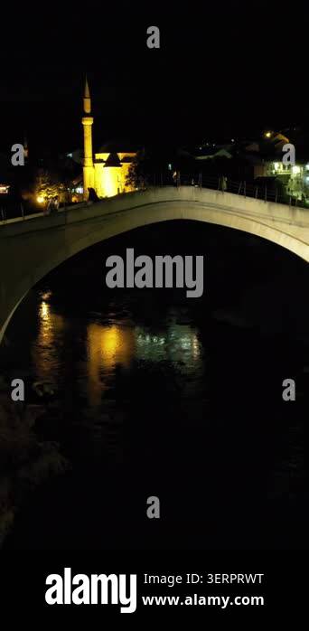 Night illuminated drone view of the historical Mostar bridge ...