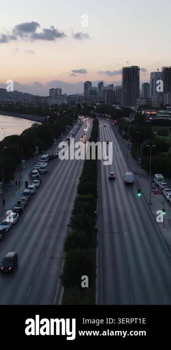 Traffic of the city by the sea at sunset, beautiful harmony of green ...