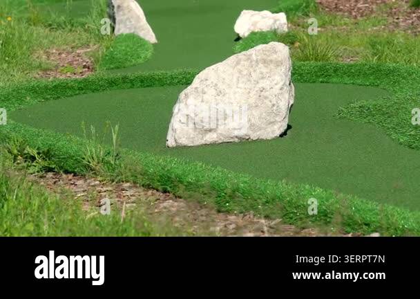 Mini golf course with artificial grass and large rocks Stock Video ...