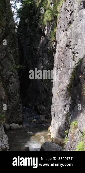 A young man walking canyon river aerial view, nature walks among the ...