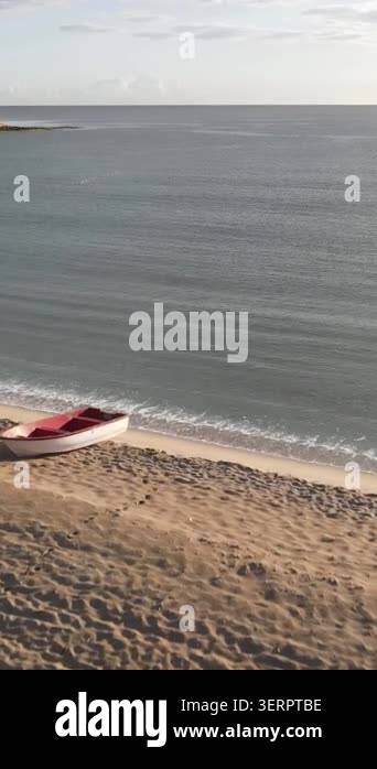 Aerial drone view of idle boats in quiet seaside bay, calm blue waters ...