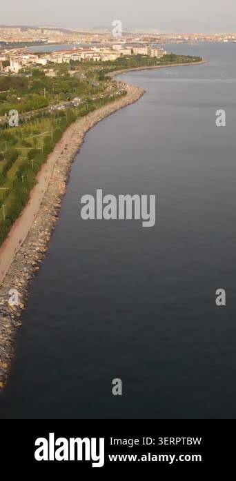 Aerial of the flying over coastal city along the coast, view of city ...