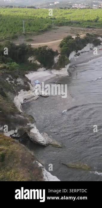 Aerial top-view waves break near the beach, sea waves on the dangerous ...