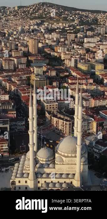 Aerial view of the mosque between the buildings, people pray in the ...