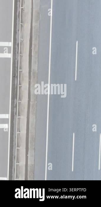 An aerial view of the two sides of a highway surrounded by trees in ...