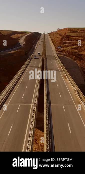 Aerial view of both sides of a highway surrounded by countryside, car ...