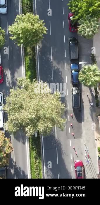 Aerial view of the street where the house with a pool on the roof is ...