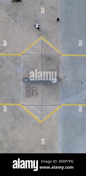 Aerial drone view of a skate park among autumn trees, people having fun ...