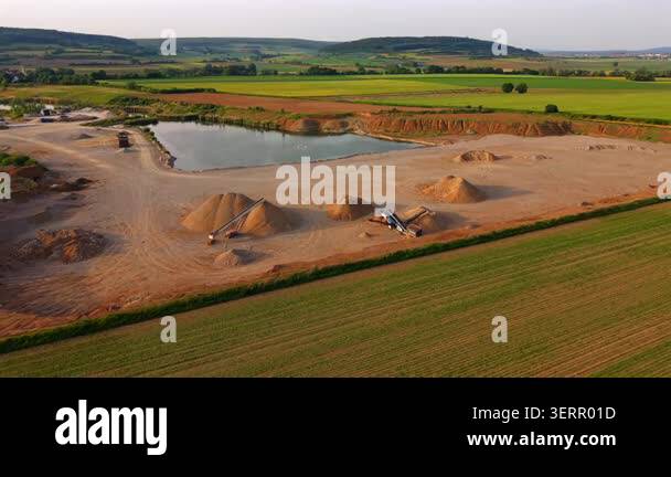 Elevated drone perspective of a gravel factory and quarry site showing ...
