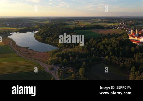 Drone view of Roggenburger Klosterweiher lake during a calm summer ...