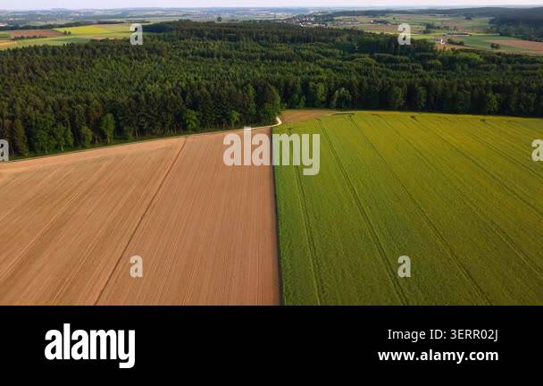 Aerial drone inspection of German farmland in late May showing green ...