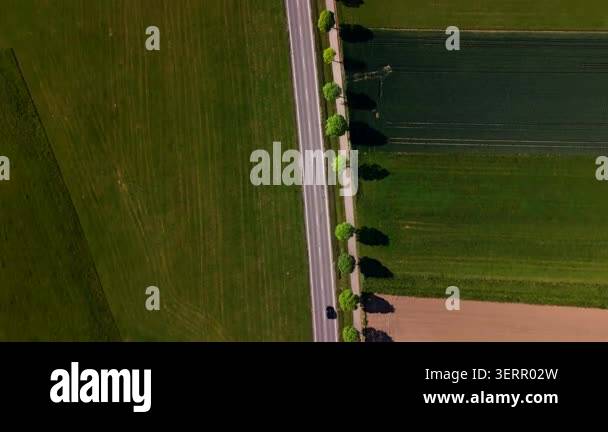 Aerial drone view of secondary rural road between villages in Germany ...