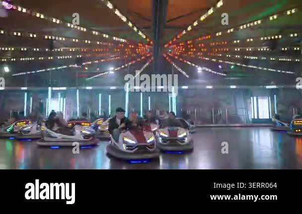 May 1, 2026. Munich, Germany. Colorful lights illuminating bumper cars ...
