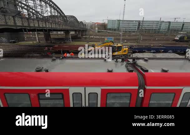 March 14, 2026. Munich, Germany. Rail workers replacing sleepers near a ...