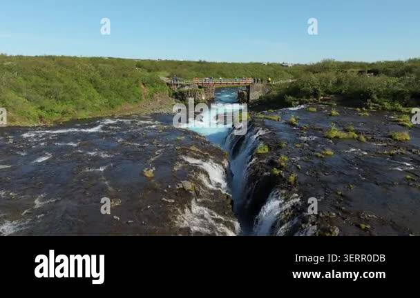 Aerial flight over the famous and beautiful Bruarfoss waterfall on a ...