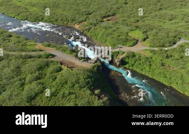 Aerial flight over the famous and beautiful Bruarfoss waterfall on a ...