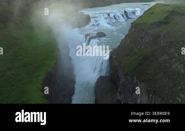 Aerial flight over the famous Dettifoss waterfall on a summer evening ...