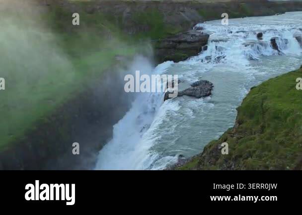Aerial flight over the famous Dettifoss waterfall on a summer evening ...