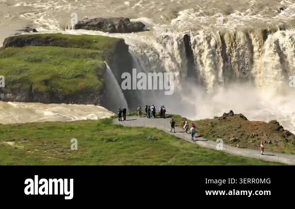 Aerial flight over the famous Godafoss waterfall on a summer day in ...