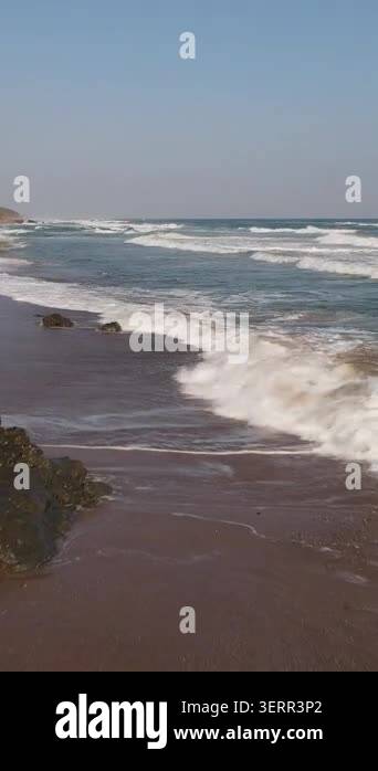 Watching ocean sea waves on rock aerial view, romantic walk on the ...