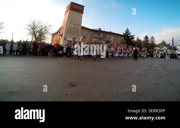 03/02/2025 - Kalipetrovo, Bulgaria: At sunset, men in traditional ...
