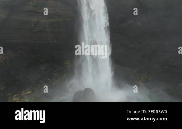 Aerial flight over the Haifoss and Grannifoss waterfall on a summer day ...