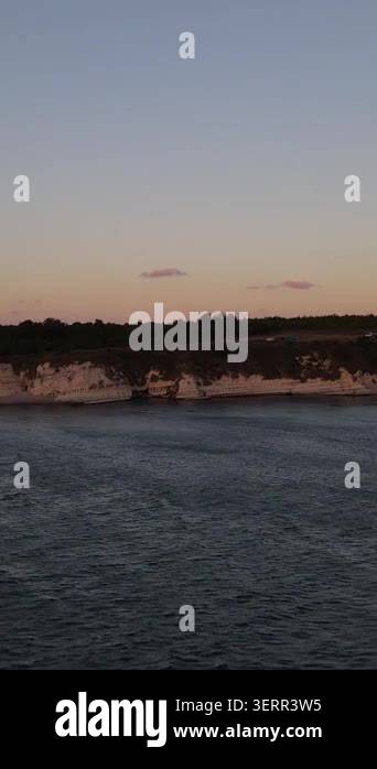 Drone aerial view over paradise coastline sunset, bay view from the sea ...