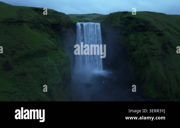 Aerial flight over the famous and powerfull Skogafoss waterfall on a ...