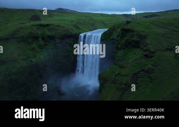 Aerial flight over the famous and powerfull Skogafoss waterfall on a ...