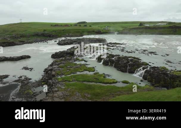 Aerial flight over the beautiful Urridafoss waterfall on a summer day ...