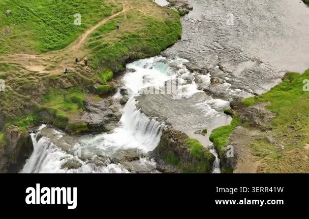Aerial flight over the Reykjafoss waterfall on a summer day in Iceland ...