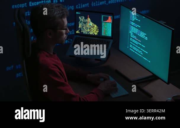 Data scientist works at night on artificial intelligence project, types ...