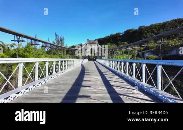 Scenic footage of the old suspension Bridge Pont Des Anglais in Saint ...